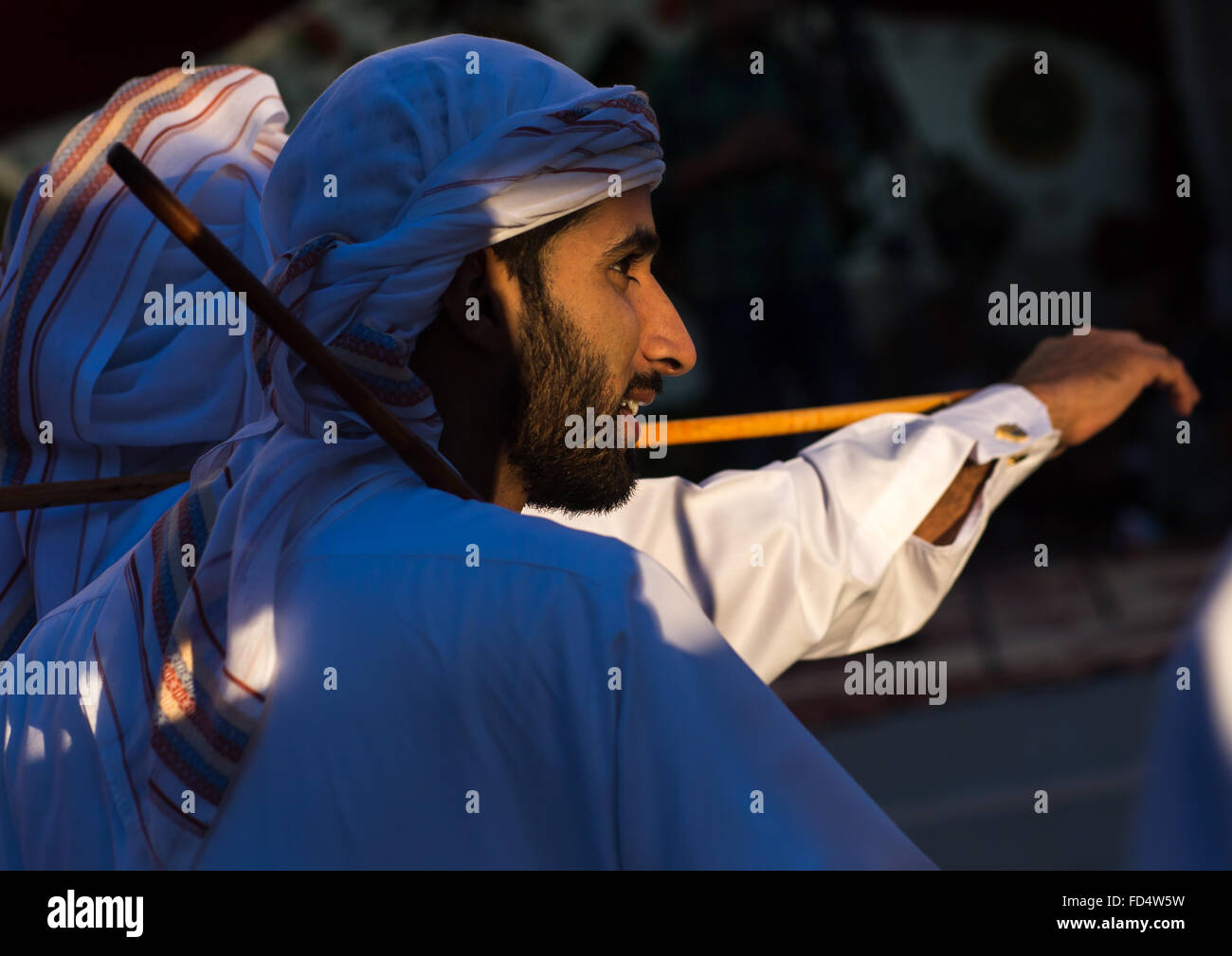 Arab men dancing sticks hi-res stock photography and images - Alamy