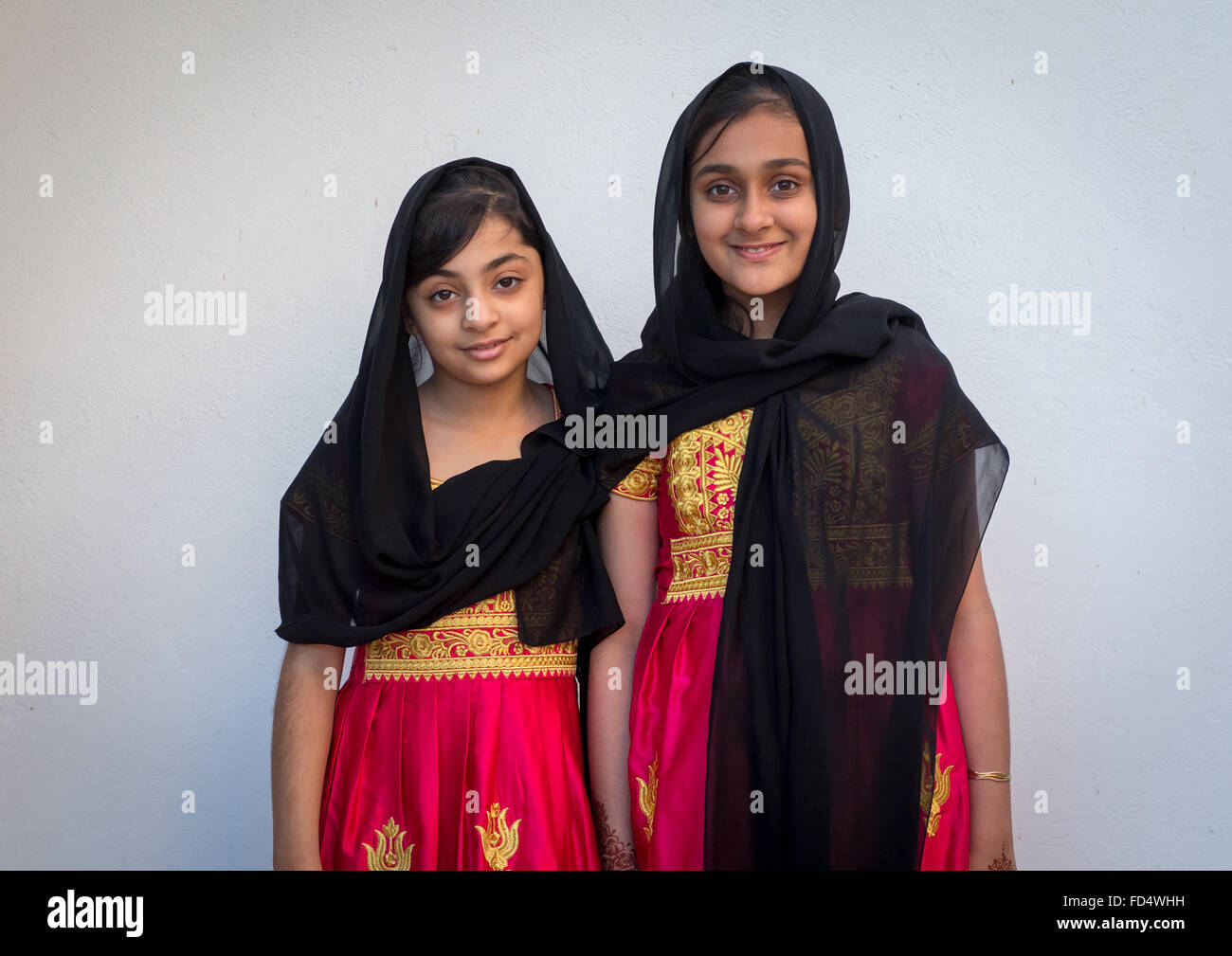 portrait of two young girls in traditional bandari clothing during a ...
