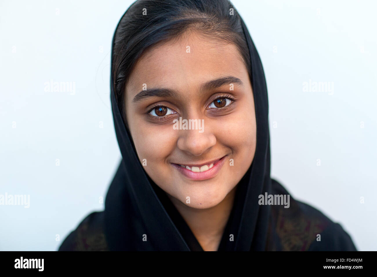 portrait of a young smiling girl in traditional bandari clothing during ...