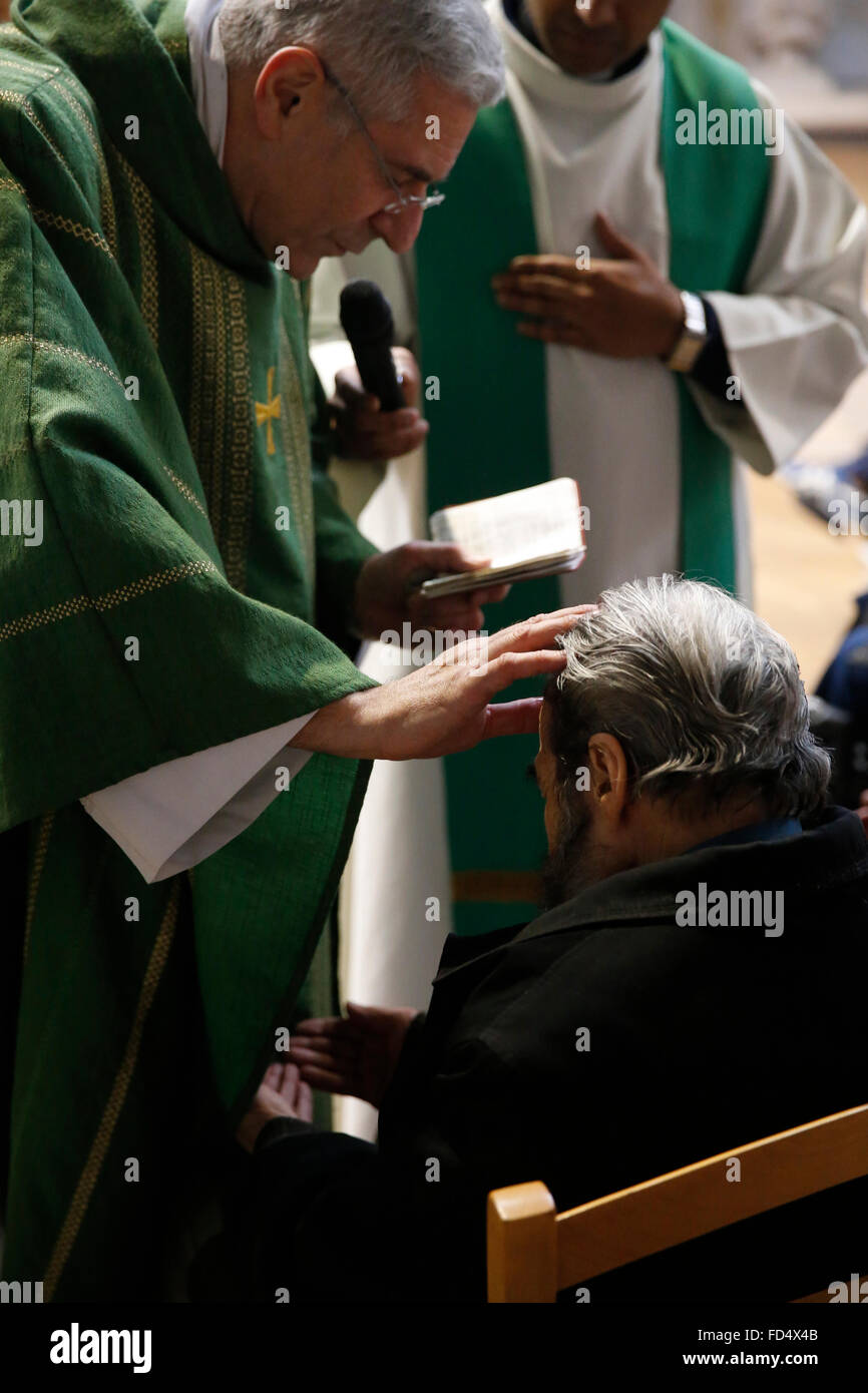 Priest anointing sick hi-res stock photography and images - Alamy