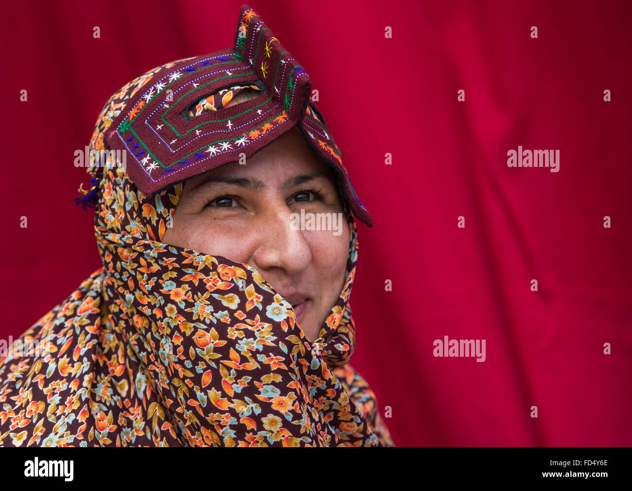 a bandari woman wearing a traditional mask called the burqa at ...