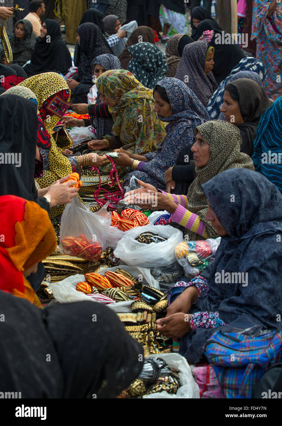 a bandari woman wearing a traditional mask called the burqa at ...
