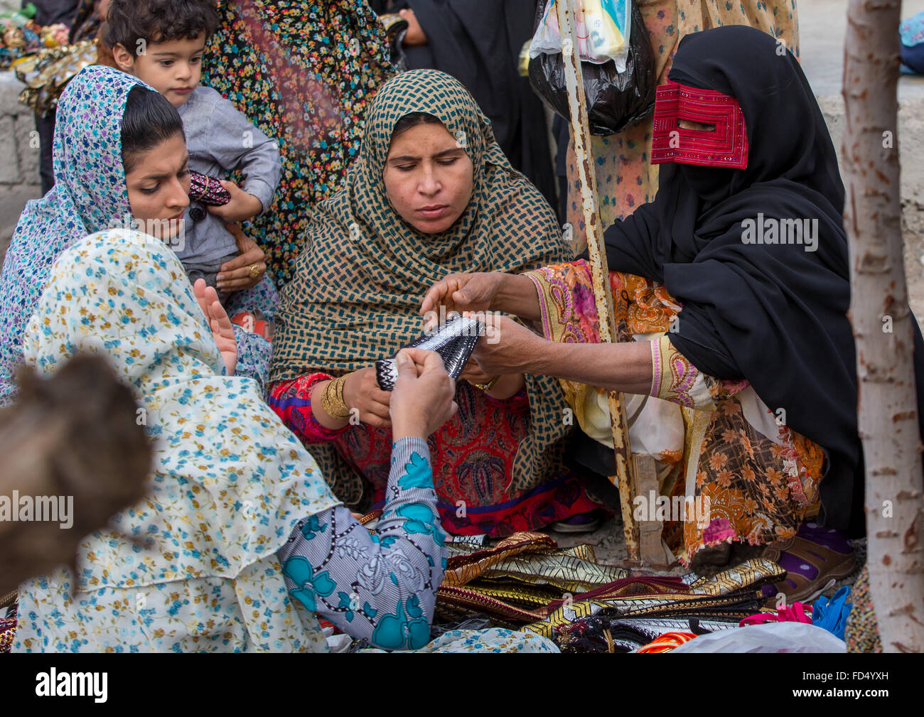 a bandari woman wearing a traditional mask called the burqa at ...