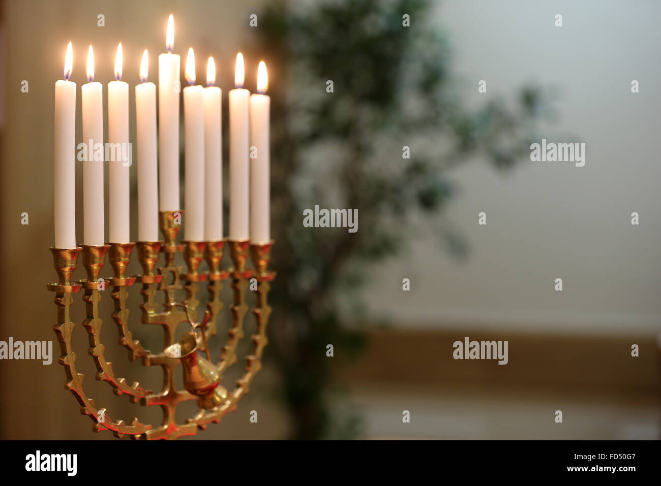 Hanukkha with nine lit candles Stock Photo - Alamy