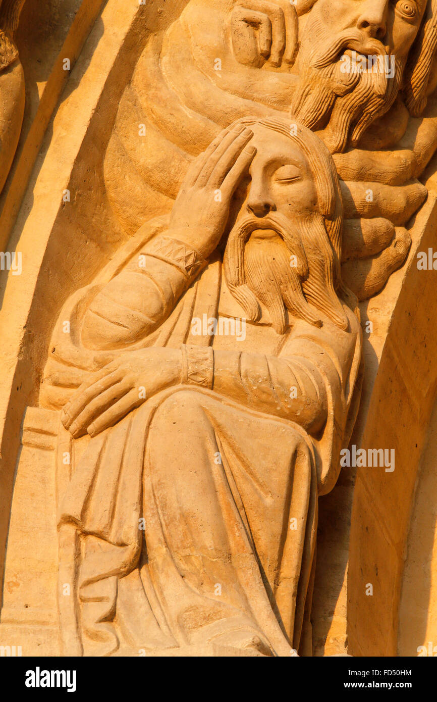 Saint Denis's basilica. Tympanum arch sculpture depicting a king of the ...