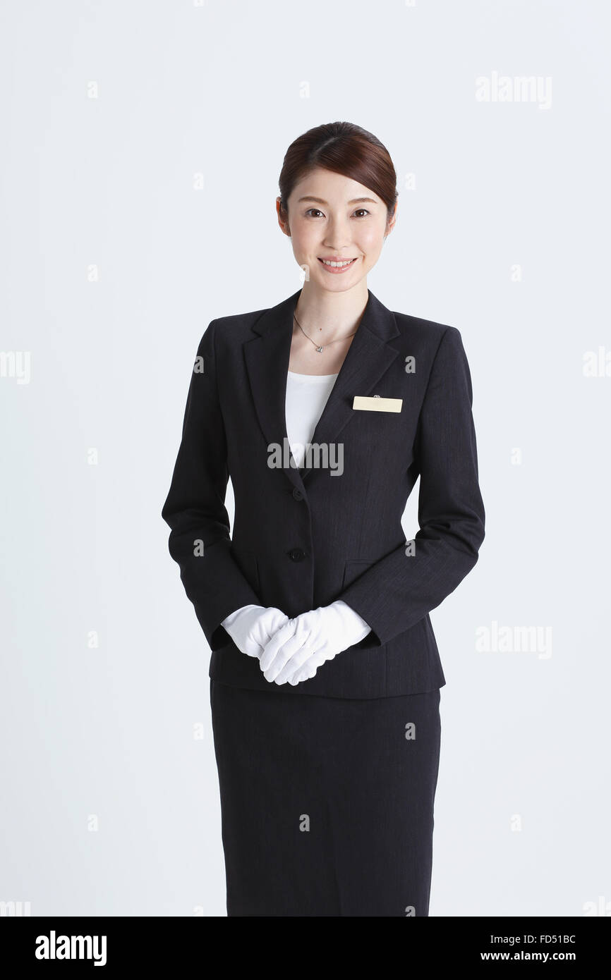 Attractive Japanese concierge Stock Photo - Alamy