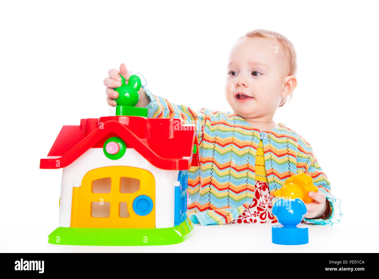 Cute baby play with toy house Stock Photo - Alamy