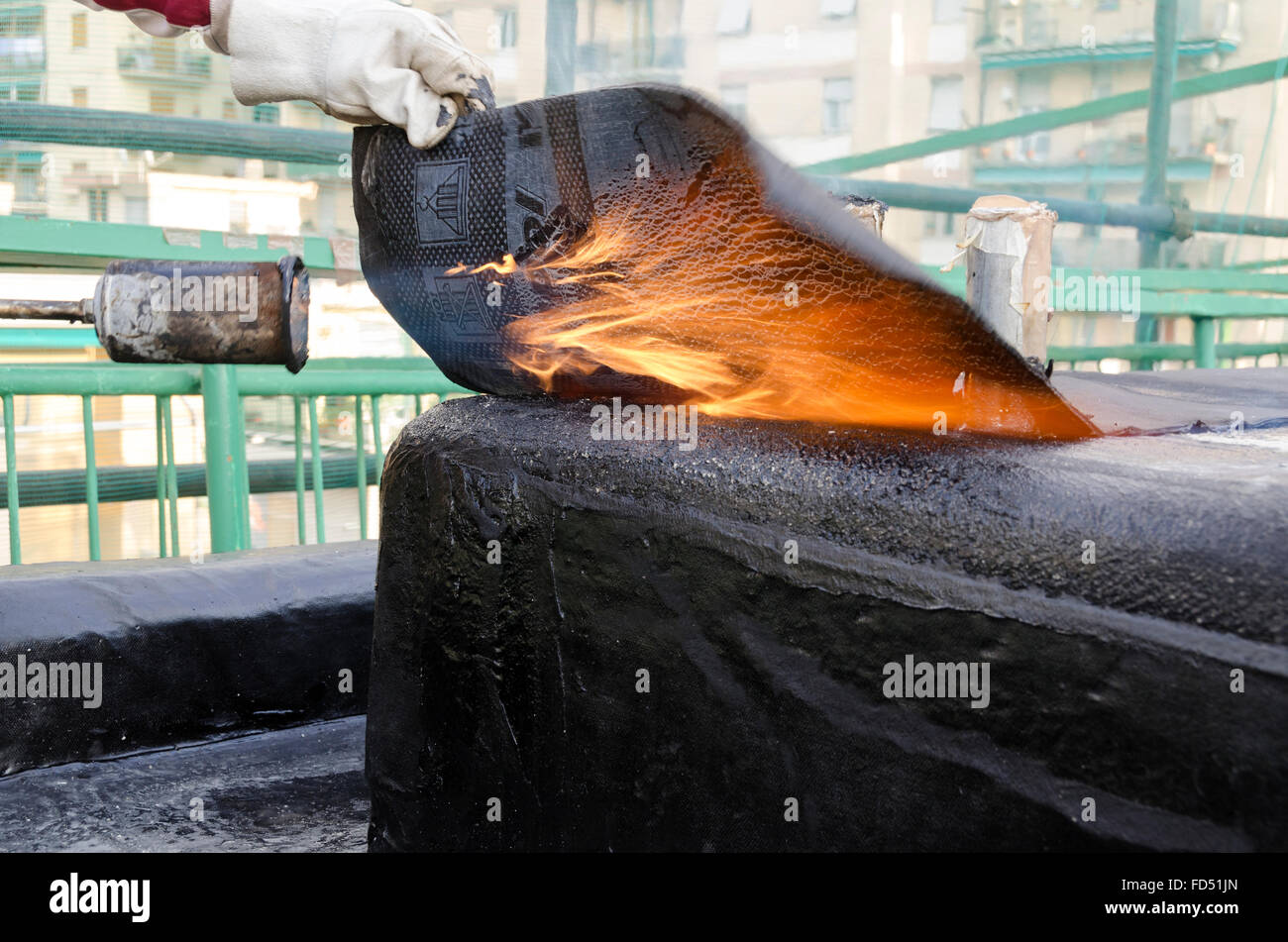 flame during welding of a waterproofing membrane on a roof Stock Photo ...
