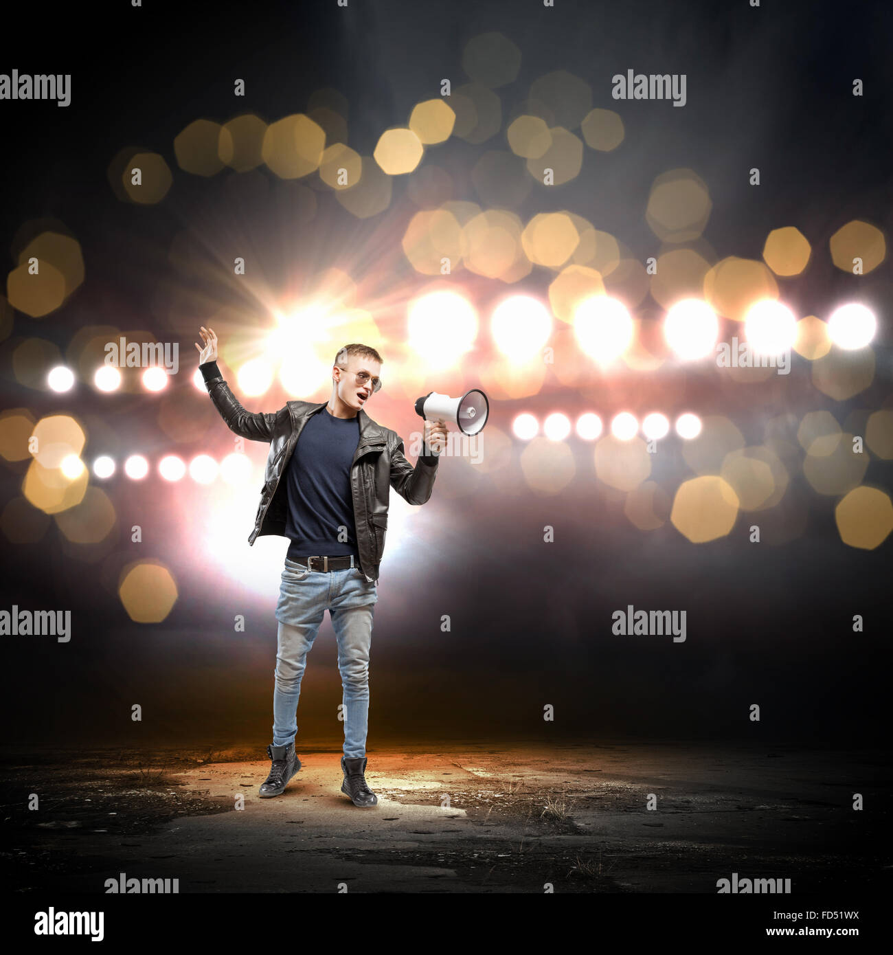 Image of young man musician singing in megaphone Stock Photo - Alamy