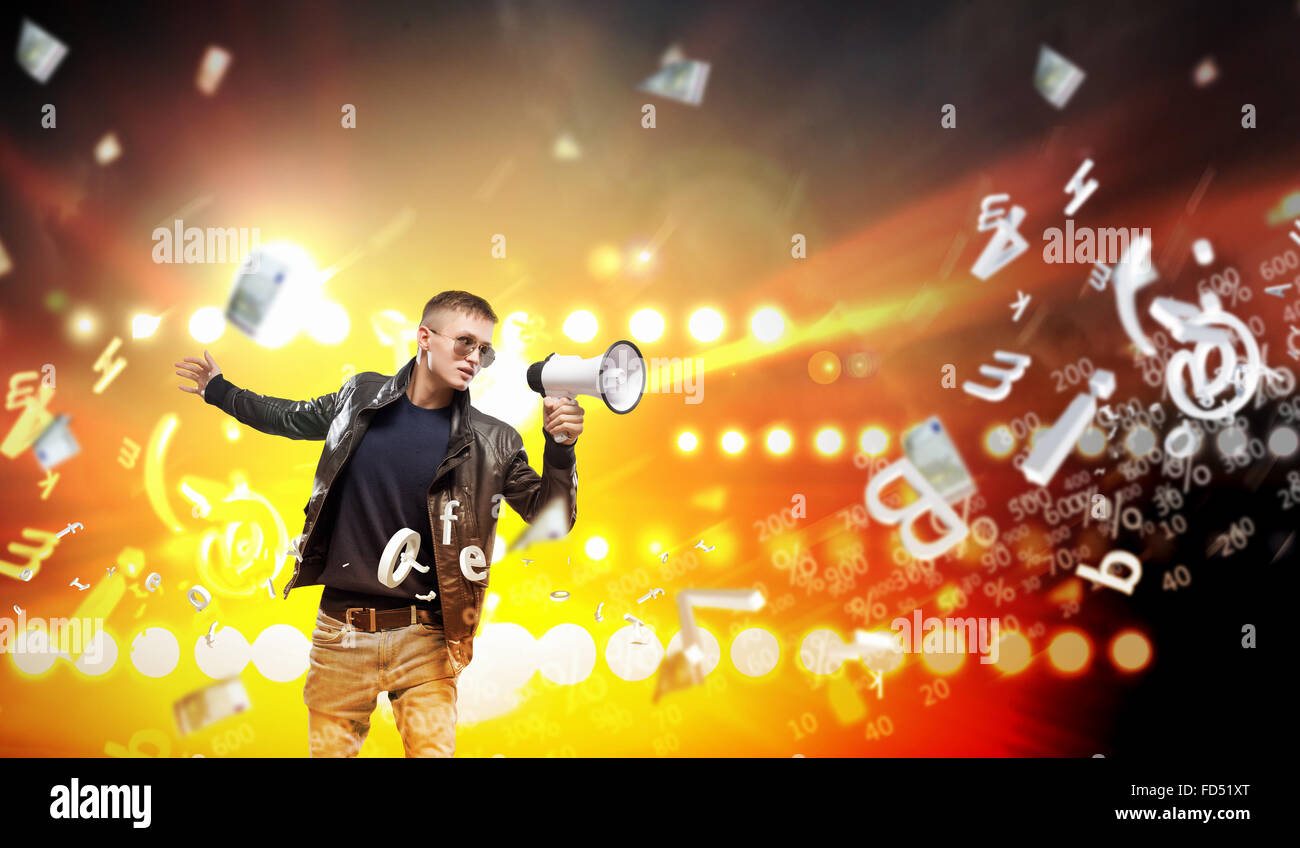 Image of young man rock musician screaming in megaphone Stock Photo - Alamy
