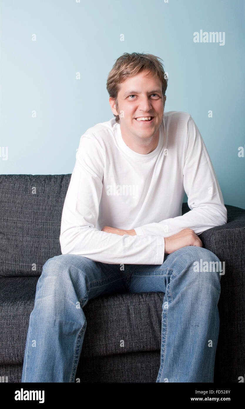 portrait of a casual man sitting down Stock Photo - Alamy