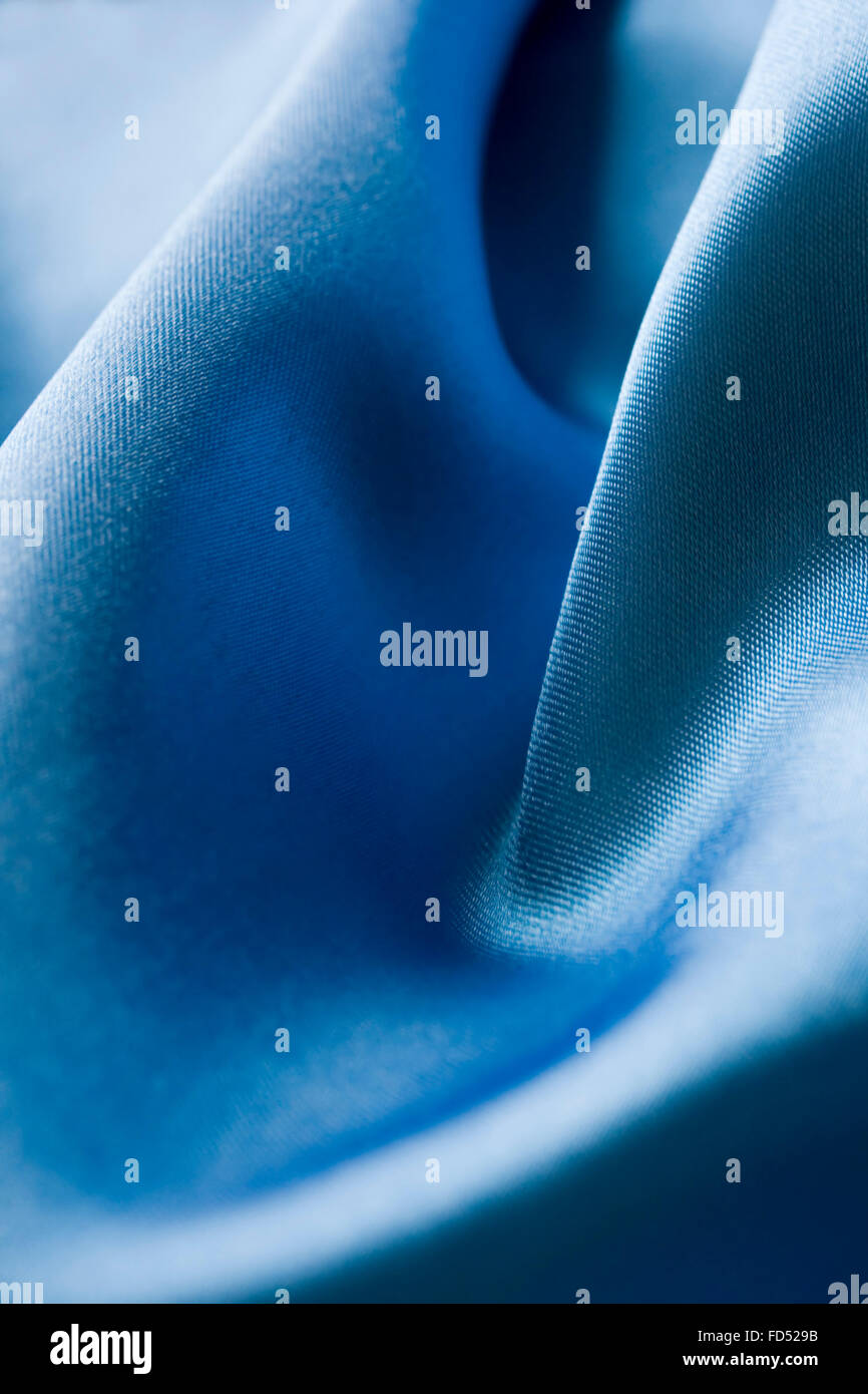 Soft blue satin fabric backdrop Stock Photo - Alamy