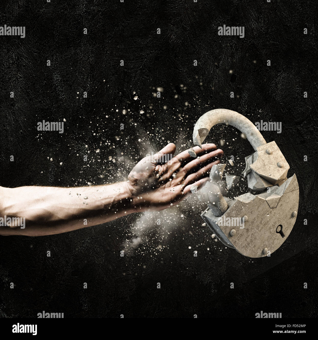 Image of human hand breaking stone lock Stock Photo - Alamy