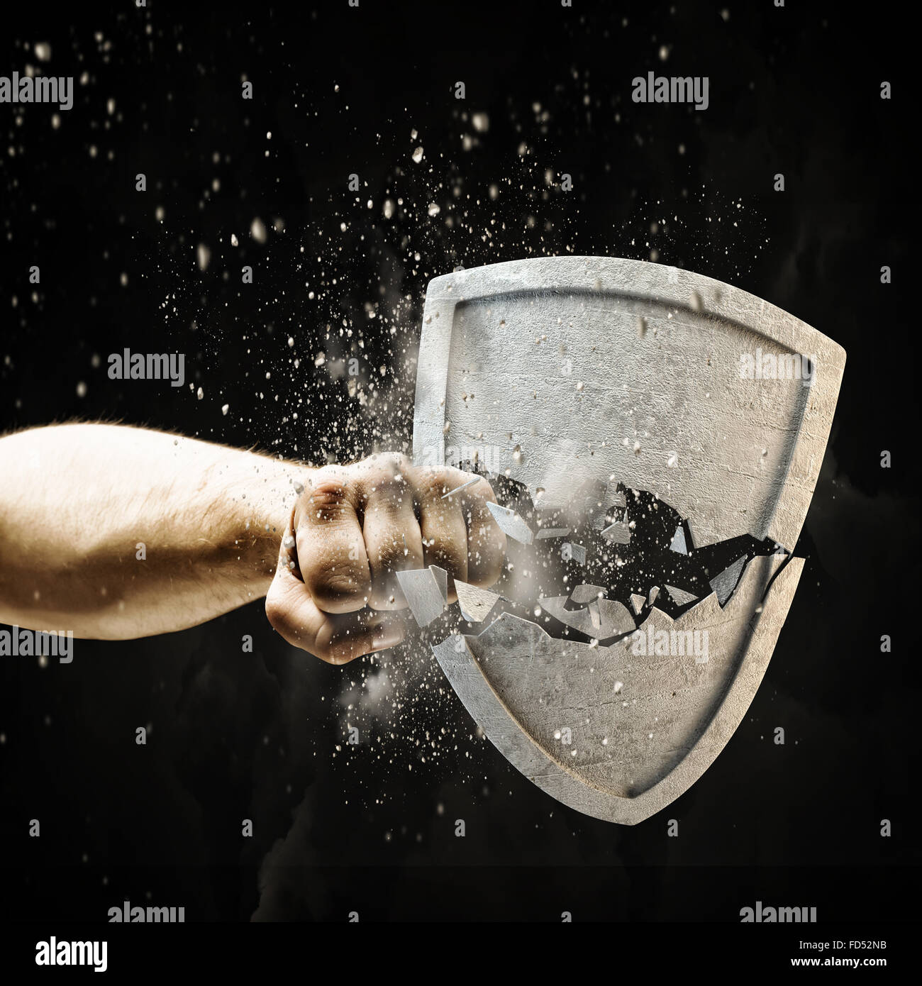 Close up of human hand breaking stone shield Stock Photo - Alamy