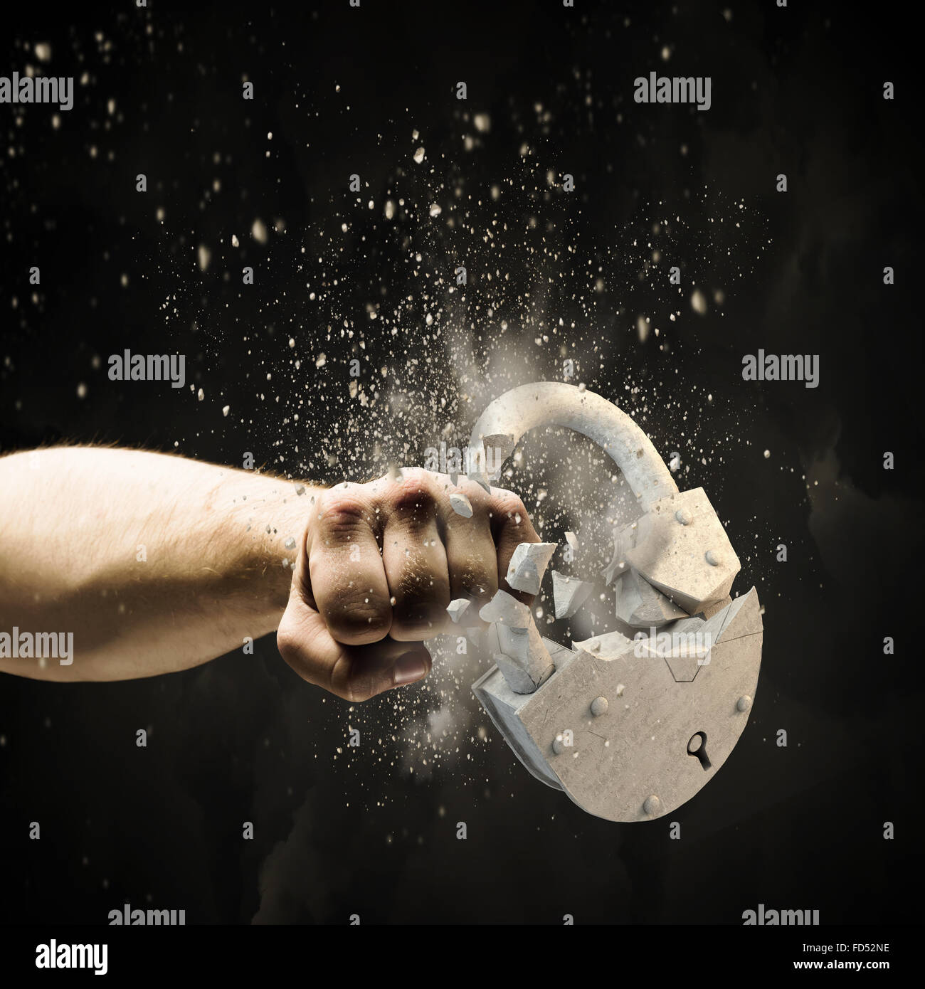Image of human hand breaking stone lock Stock Photo - Alamy