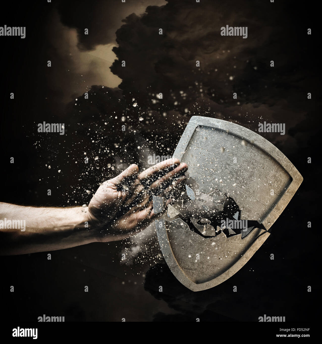 Close up of human hand breaking stone shield Stock Photo - Alamy
