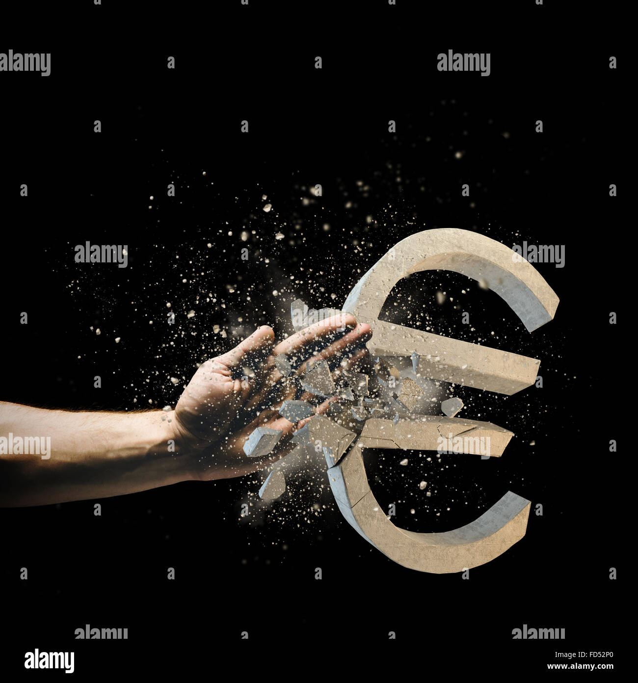 Close up image of human hand breaking euro stone symbol Stock Photo - Alamy
