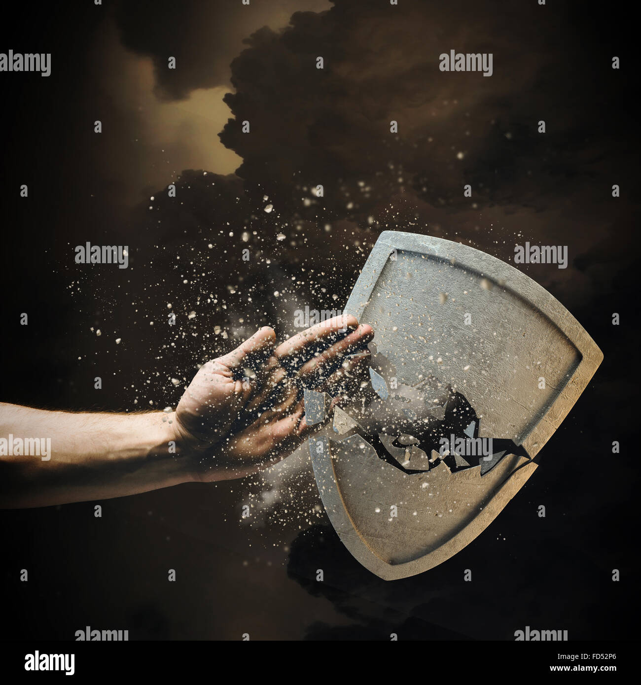 Close up of human hand breaking stone shield Stock Photo - Alamy