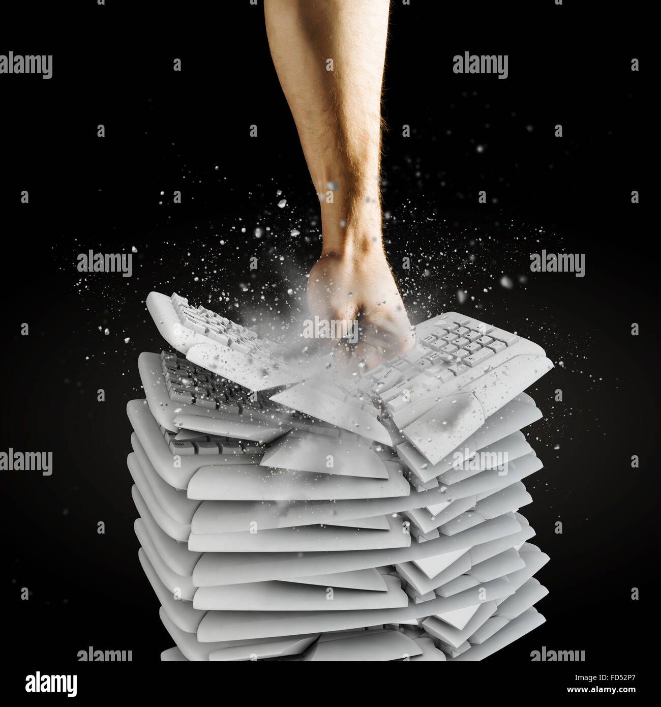 Image of human hand breaking pile of keyboards Stock Photo - Alamy