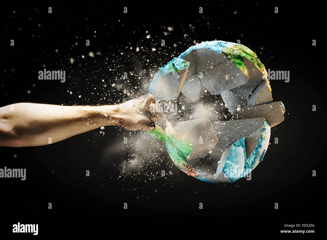 Close up image of human hand breaking earth planet Stock Photo - Alamy