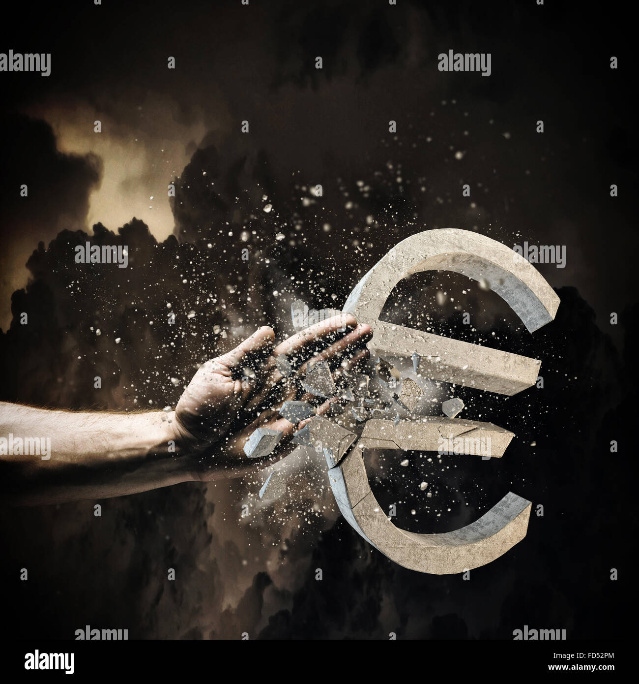 Close up image of human hand breaking euro stone symbol Stock Photo - Alamy