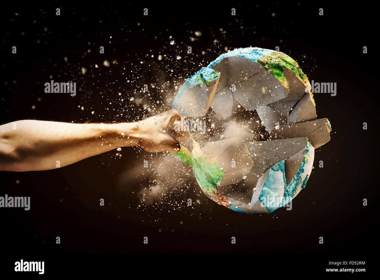 Close up image of human hand breaking earth planet Stock Photo - Alamy