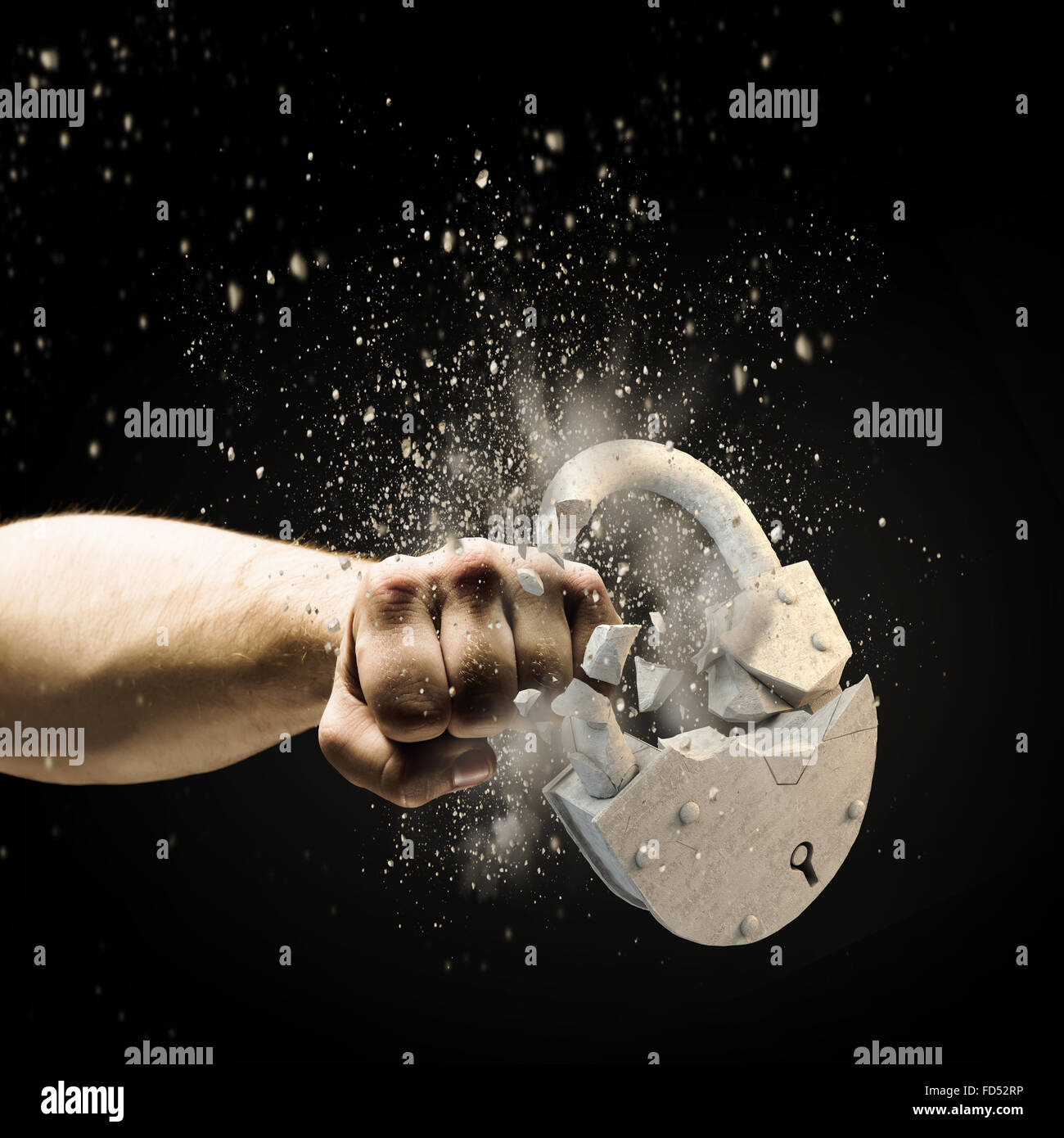 Image of human hand breaking stone lock Stock Photo - Alamy