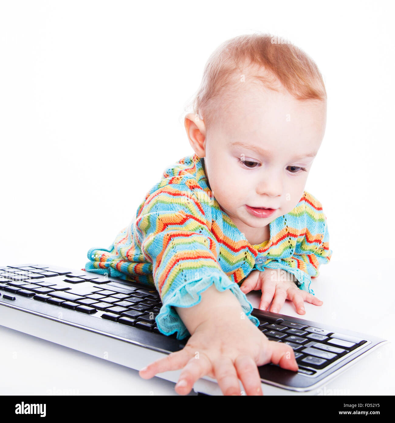 Cute baby with keyboard Stock Photo - Alamy