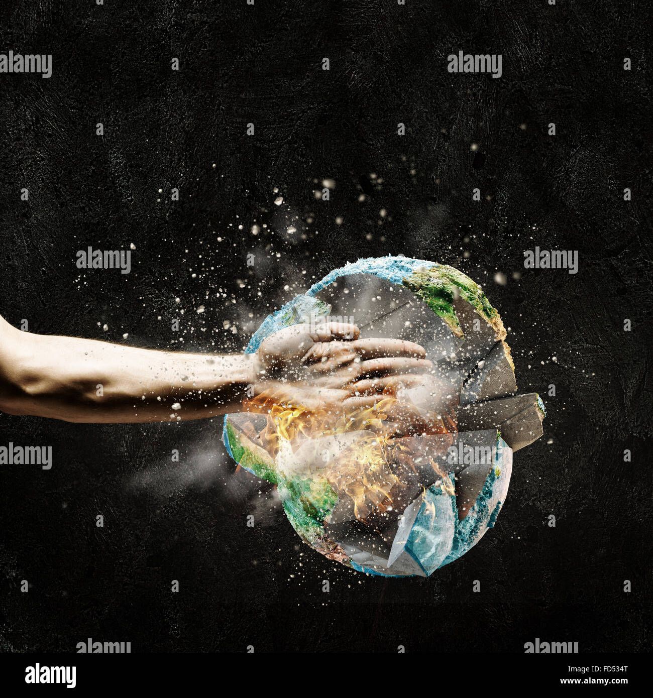Close up image of human hand breaking earth planet Stock Photo - Alamy