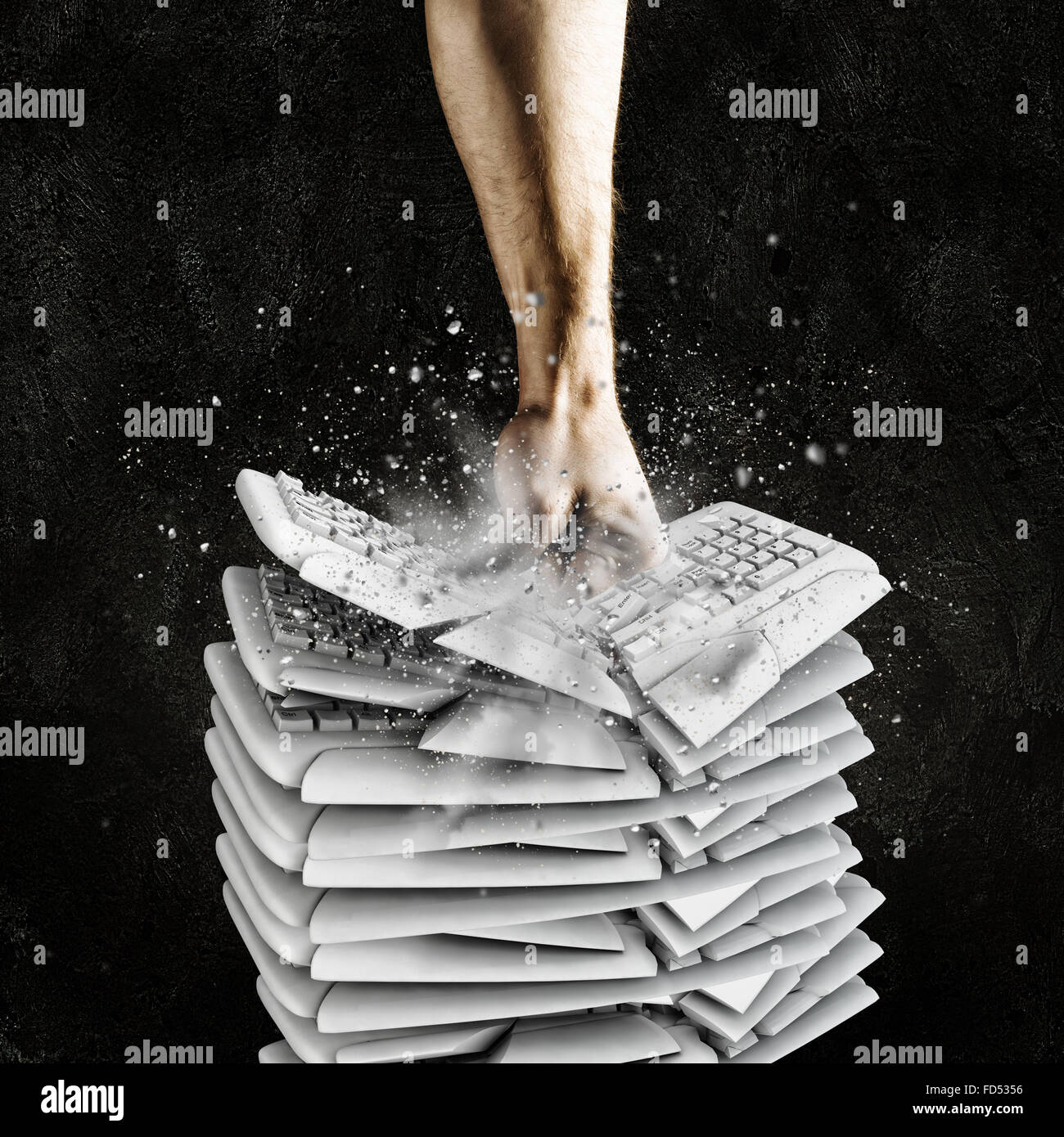 Image of human hand breaking pile of keyboards Stock Photo - Alamy