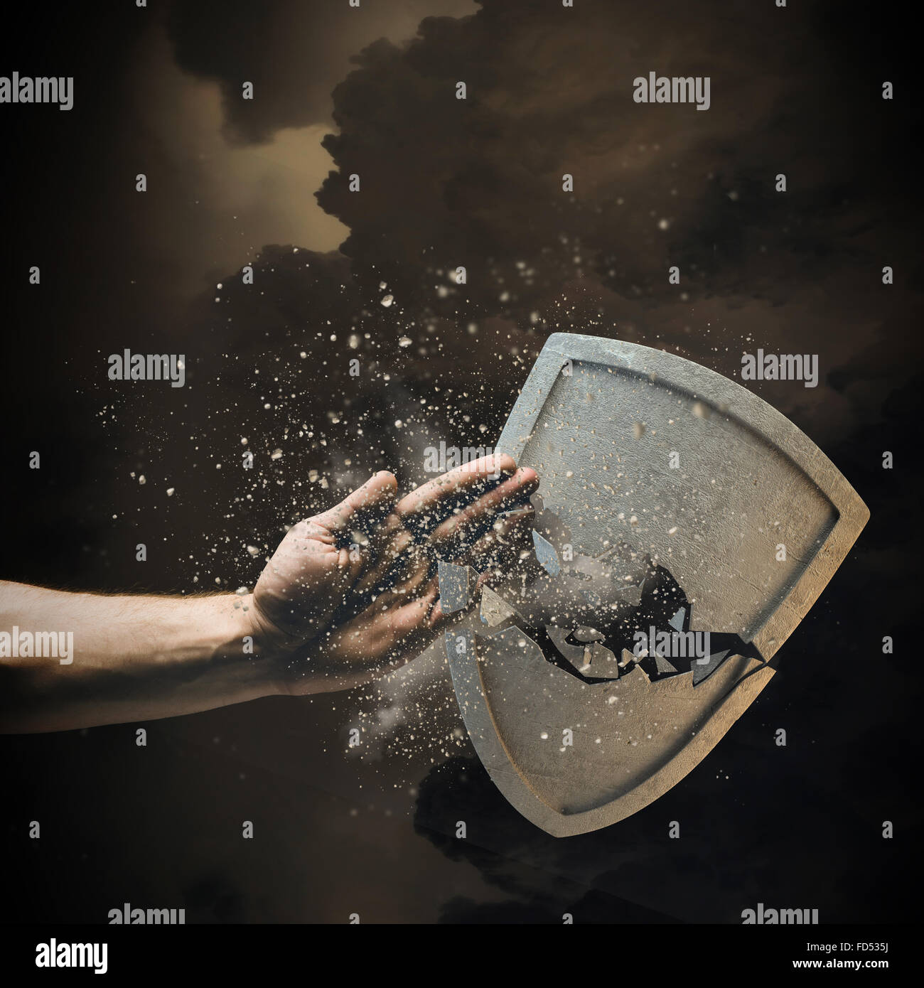 Close up of human hand breaking stone shield Stock Photo - Alamy
