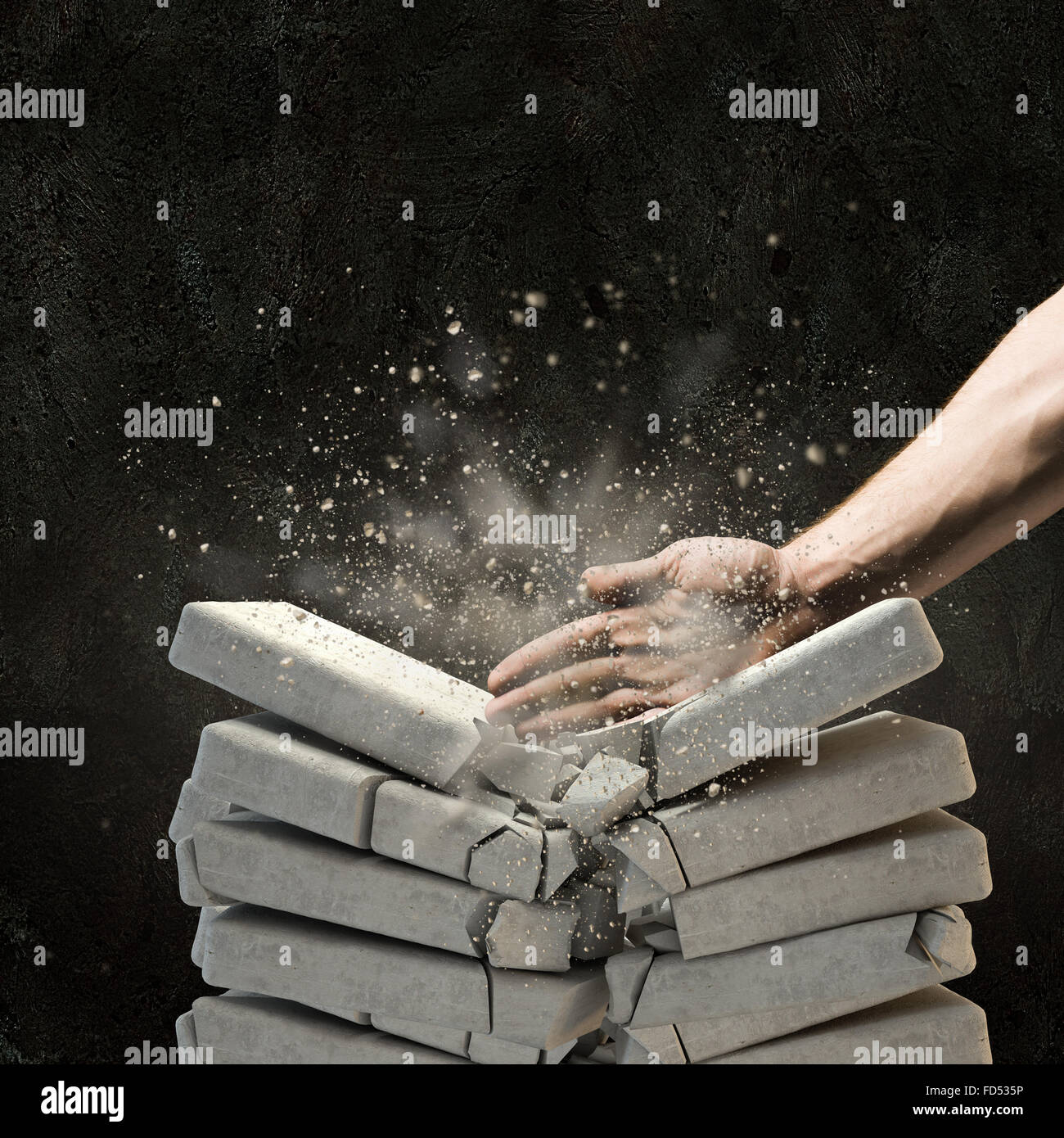 Close up of human hand breaking bricks Stock Photo - Alamy