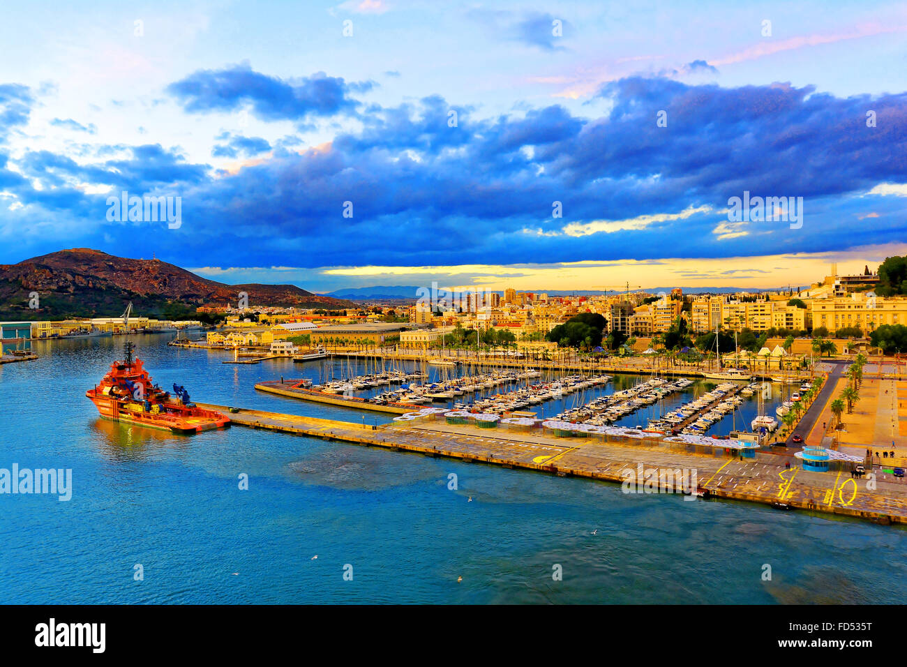 Spain Cartagena port and marina with tug boat blue red sky Stock Photo ...