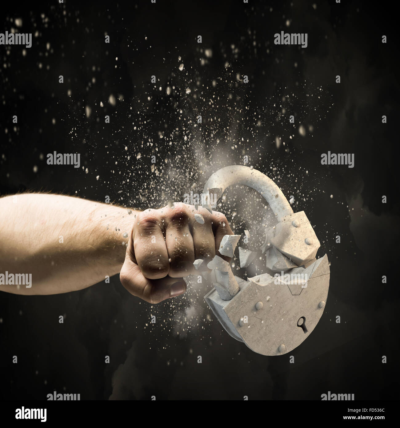 Image of human hand breaking stone lock Stock Photo - Alamy