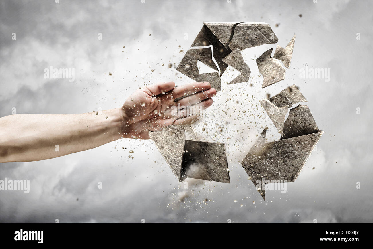 Close up image of human hand breaking recycle stone symbol Stock Photo ...