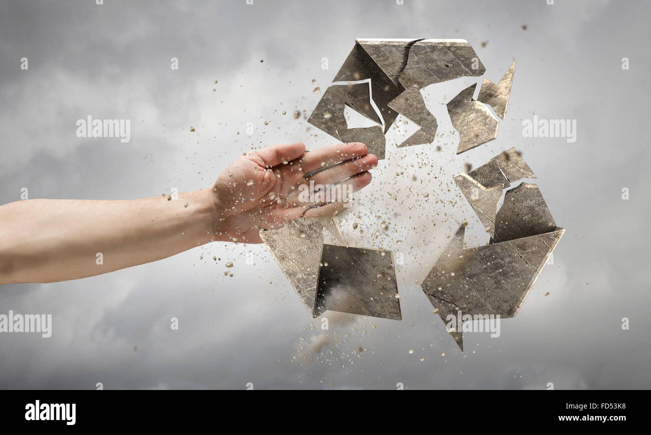 Close up image of human hand breaking recycle stone symbol Stock Photo ...
