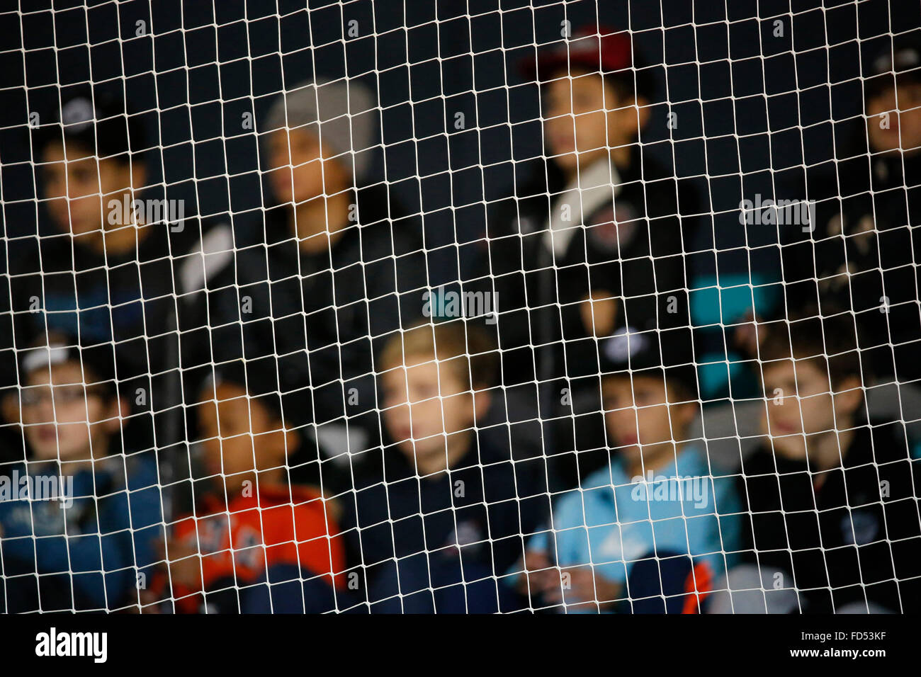 Figures behind a net Stock Photo - Alamy