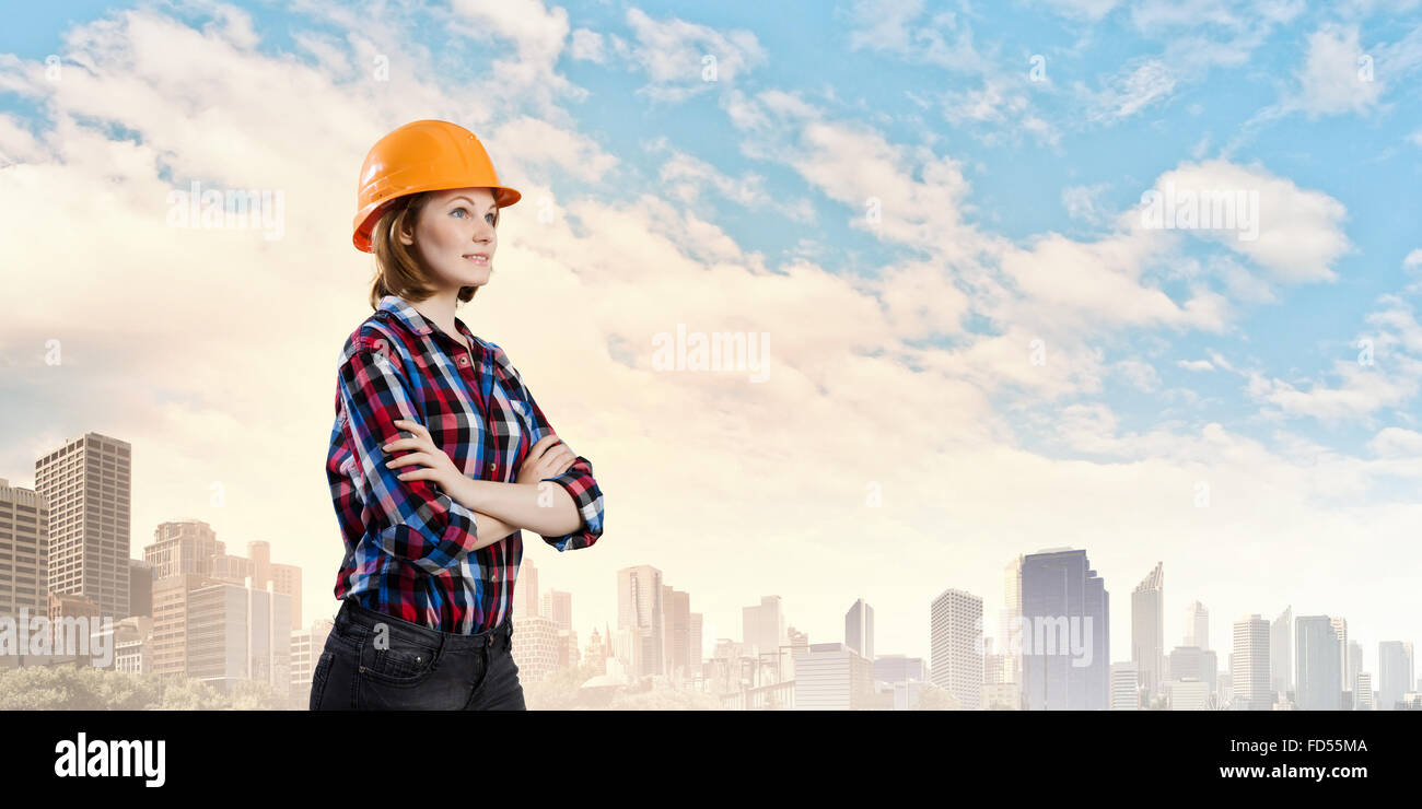 Image of woman engineer against city background Stock Photo - Alamy