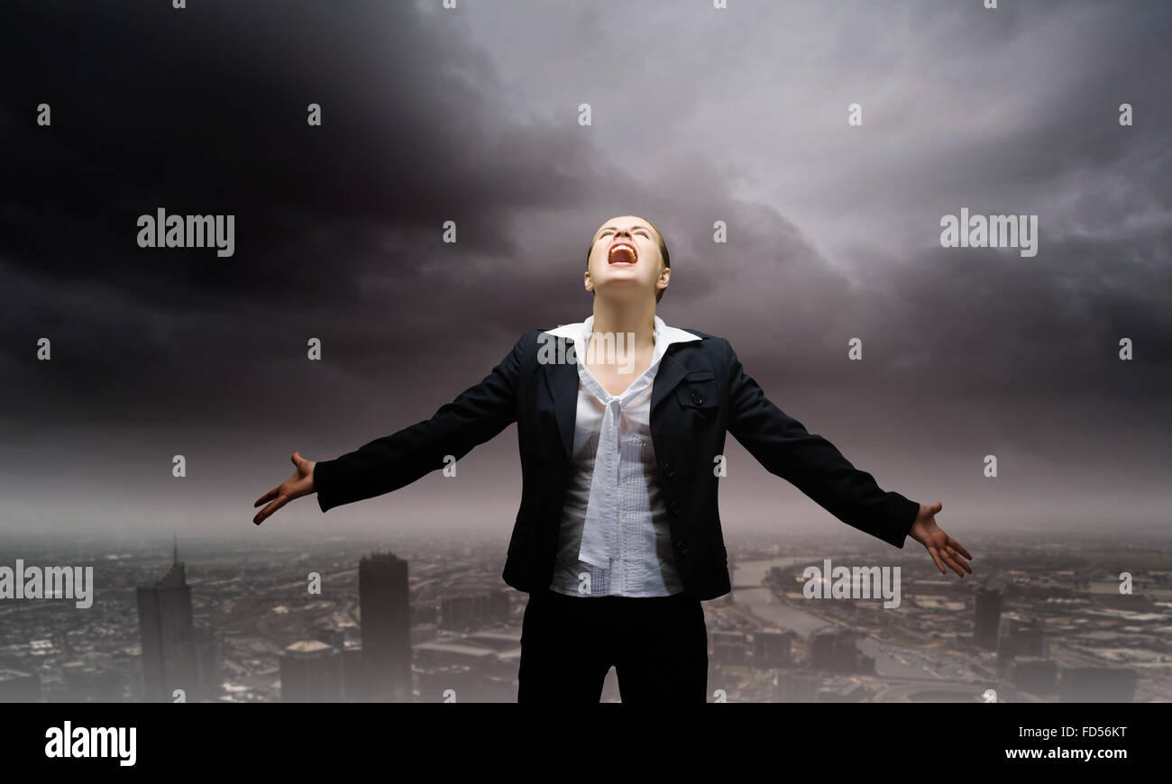Image of businesswoman on top of building screaming Stock Photo - Alamy