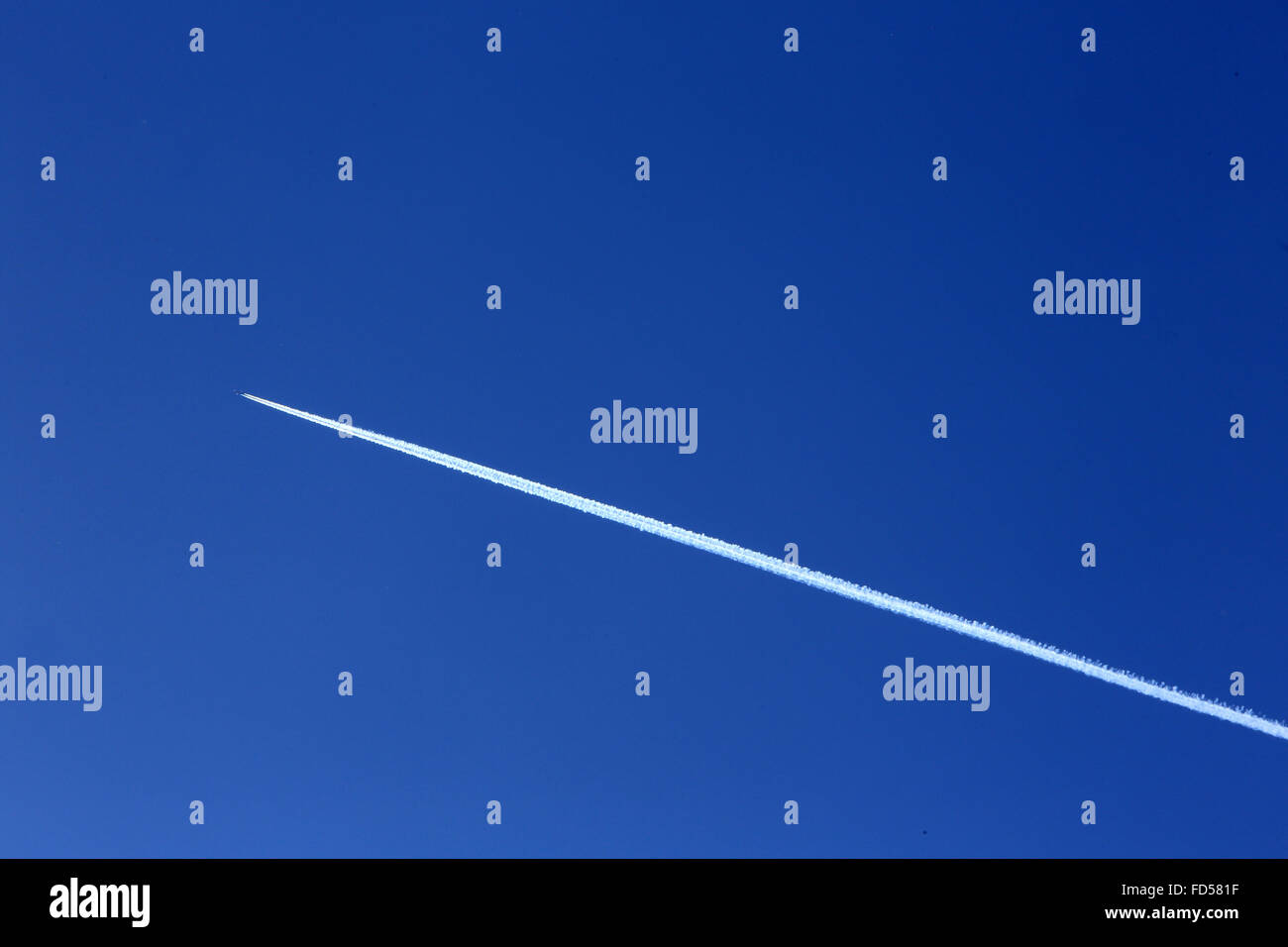 Trace of a plane in the sky Stock Photo - Alamy