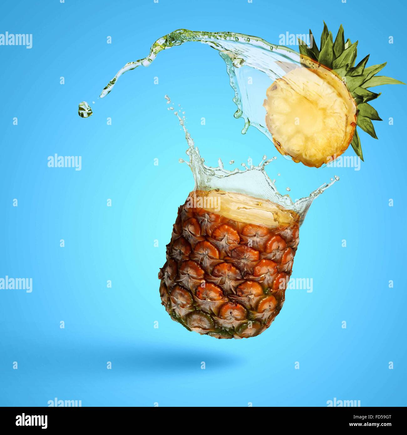 Image of fresh pineapple in juicy splashes Stock Photo - Alamy