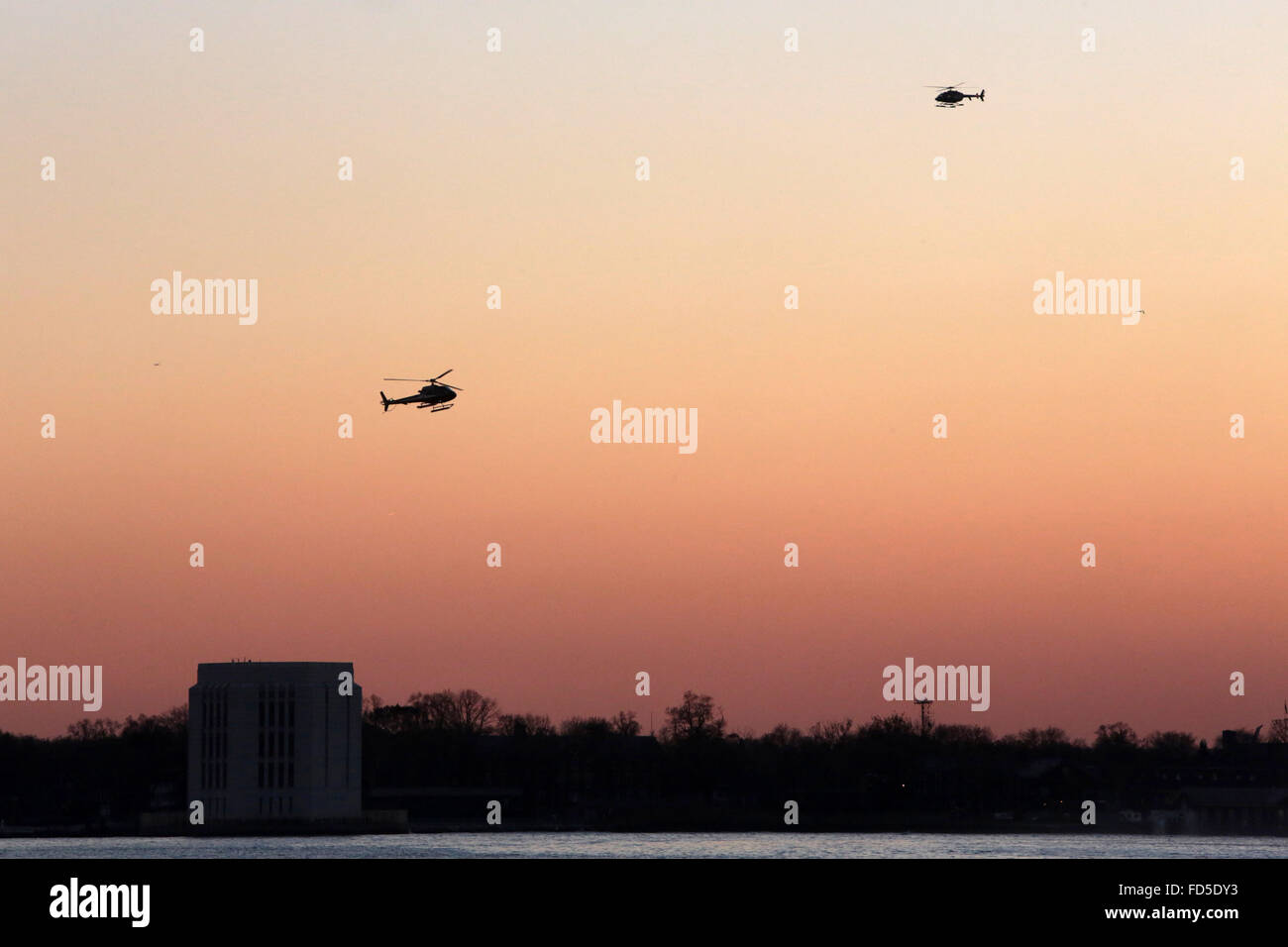 Helicopters at sunset Stock Photo - Alamy