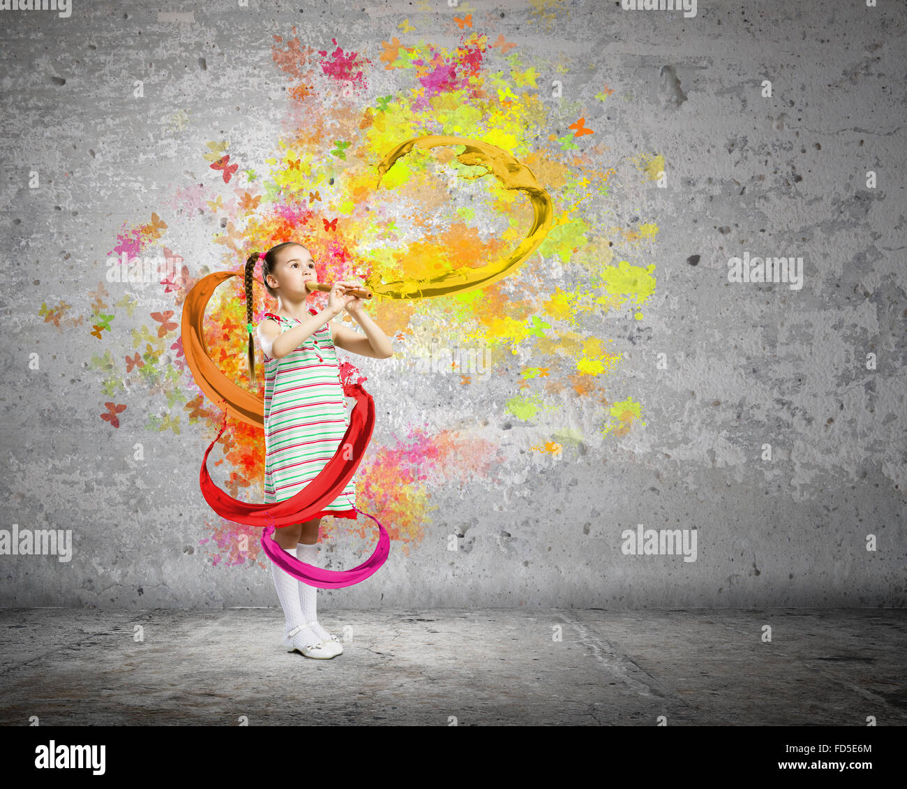 Image of little cute girl playing on flute Stock Photo - Alamy