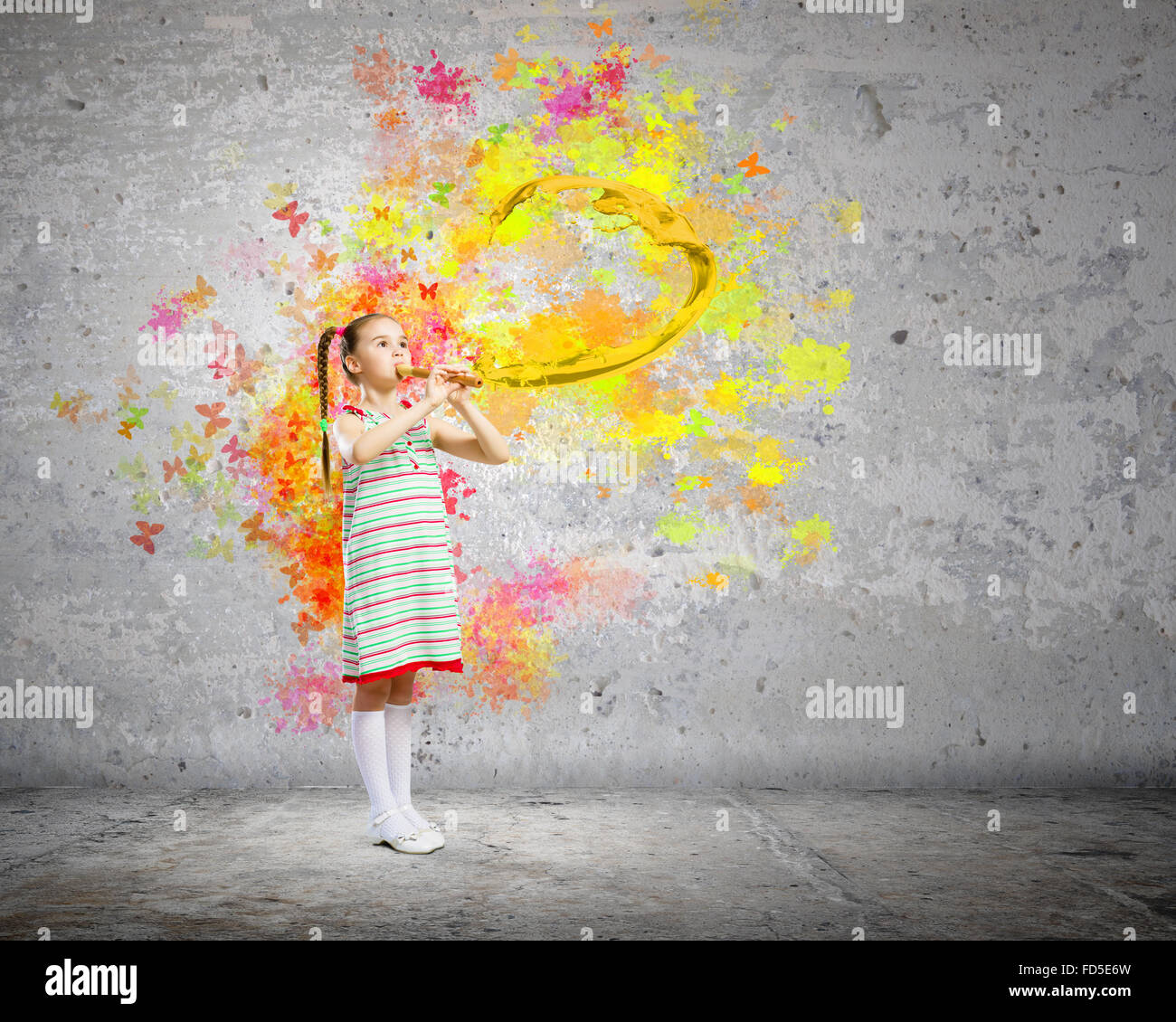 Image of little cute girl playing on flute Stock Photo - Alamy
