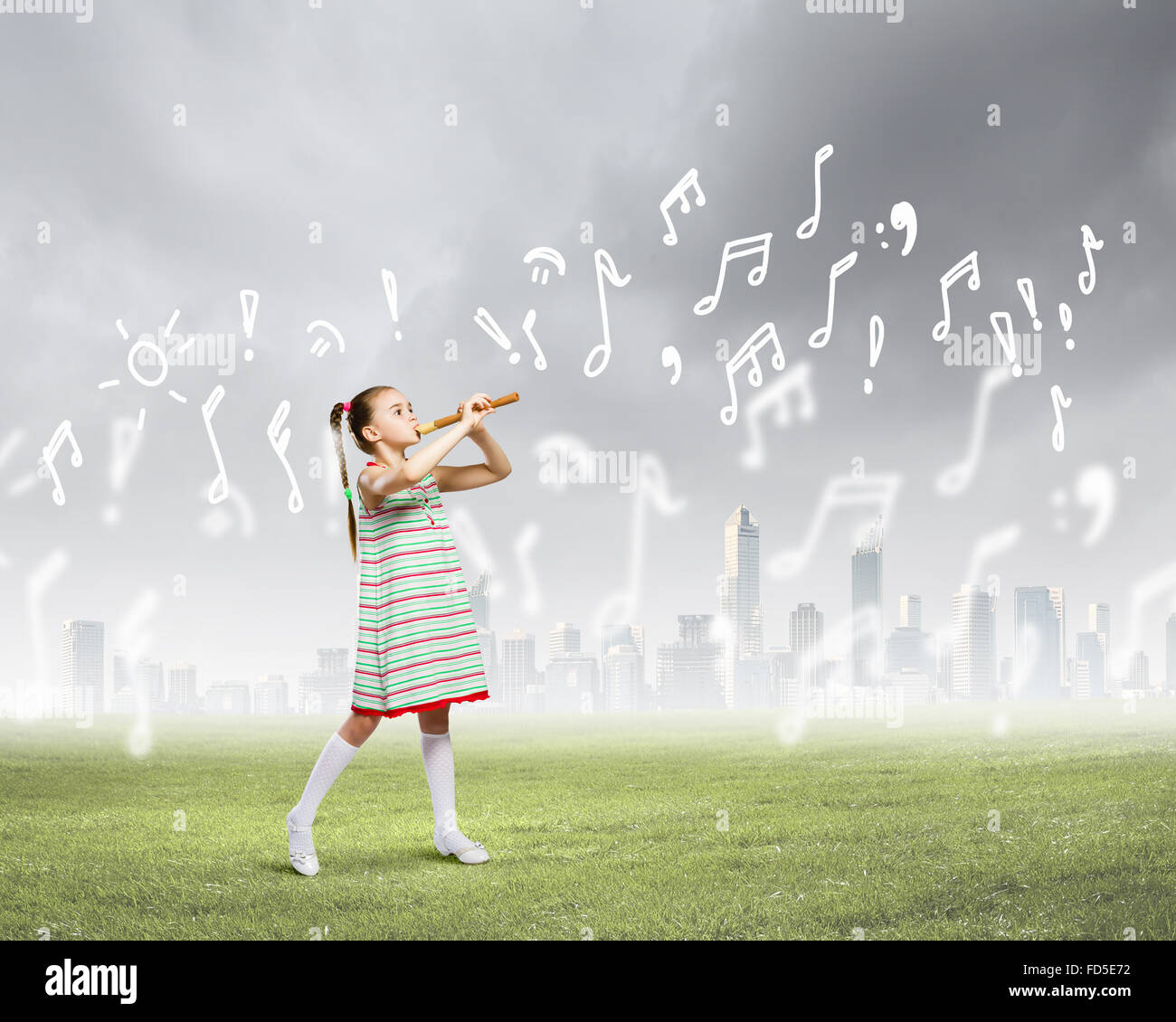 Image of little cute girl playing on flute Stock Photo - Alamy