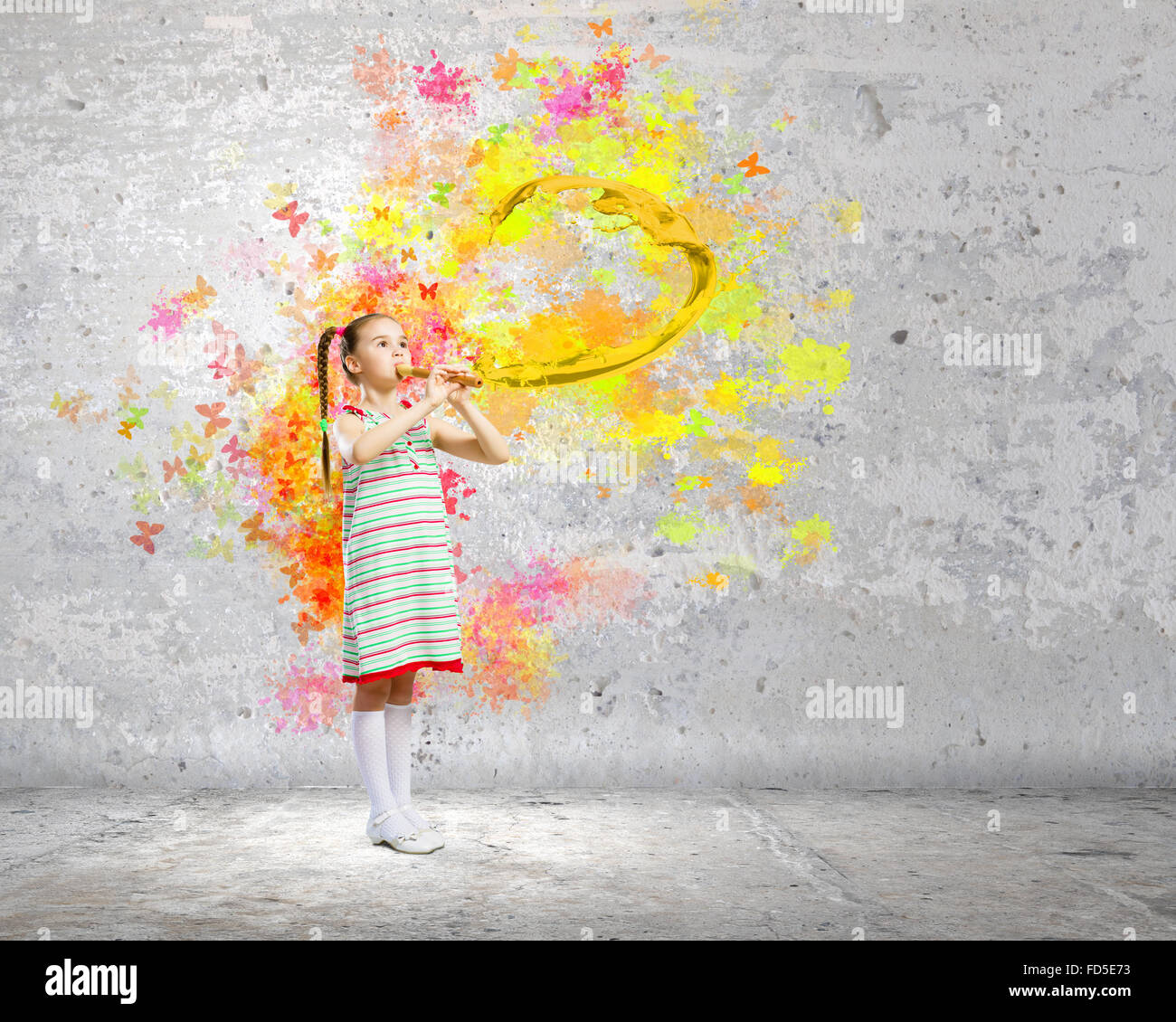Image of little cute girl playing on flute Stock Photo - Alamy