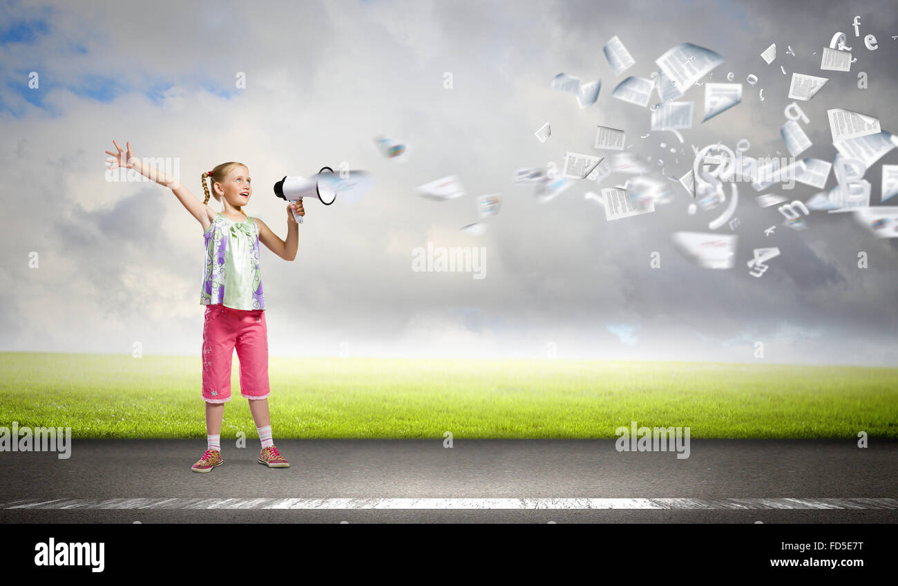 Image of little girl shouting into megaphone Stock Photo - Alamy