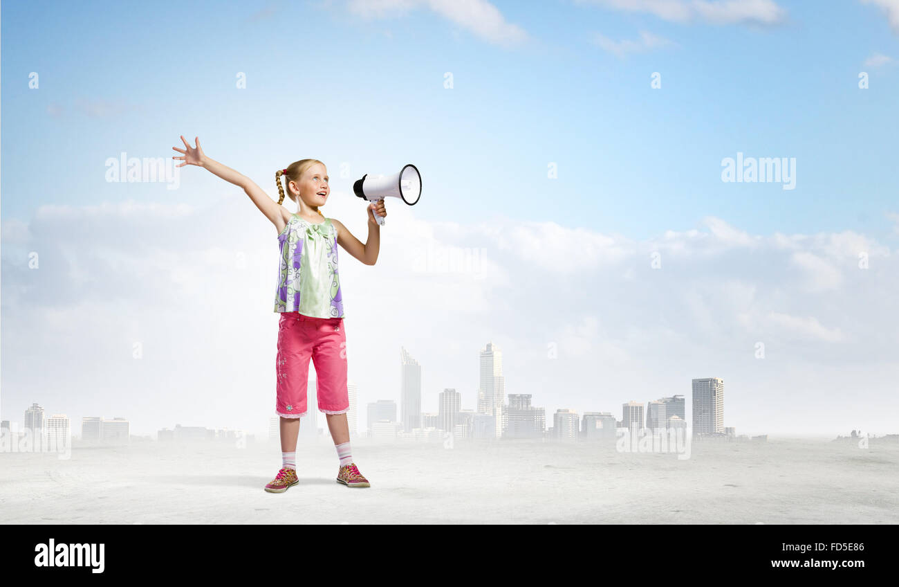 Image of little girl shouting into megaphone Stock Photo - Alamy