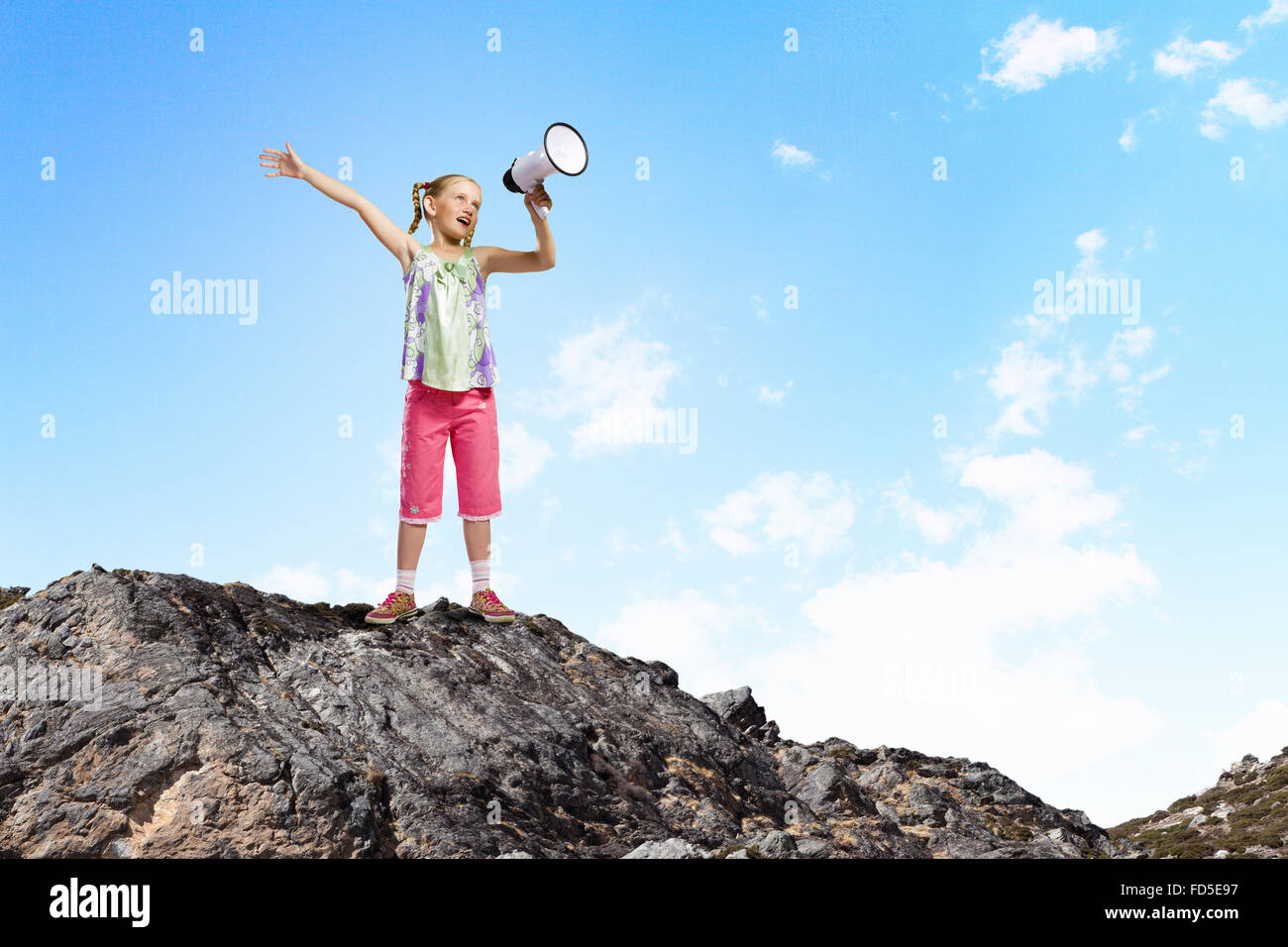 Image of little girl shouting into megaphone Stock Photo - Alamy