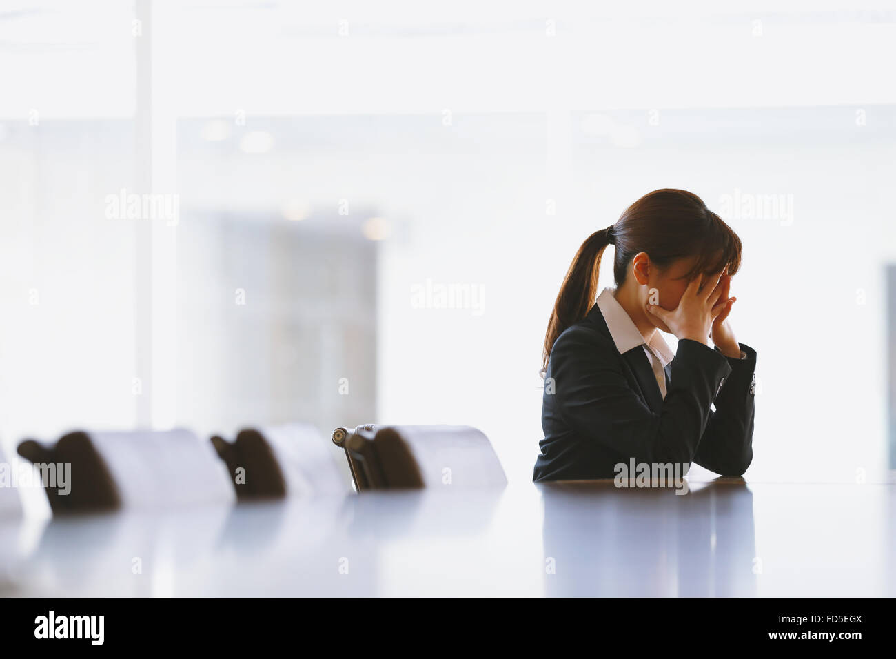 Tired Japanese businesswoman Stock Photo - Alamy